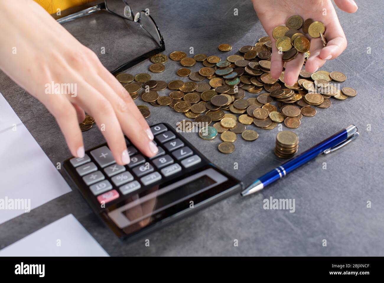 Girl counting pennies hi-res stock photography and images - Alamy
