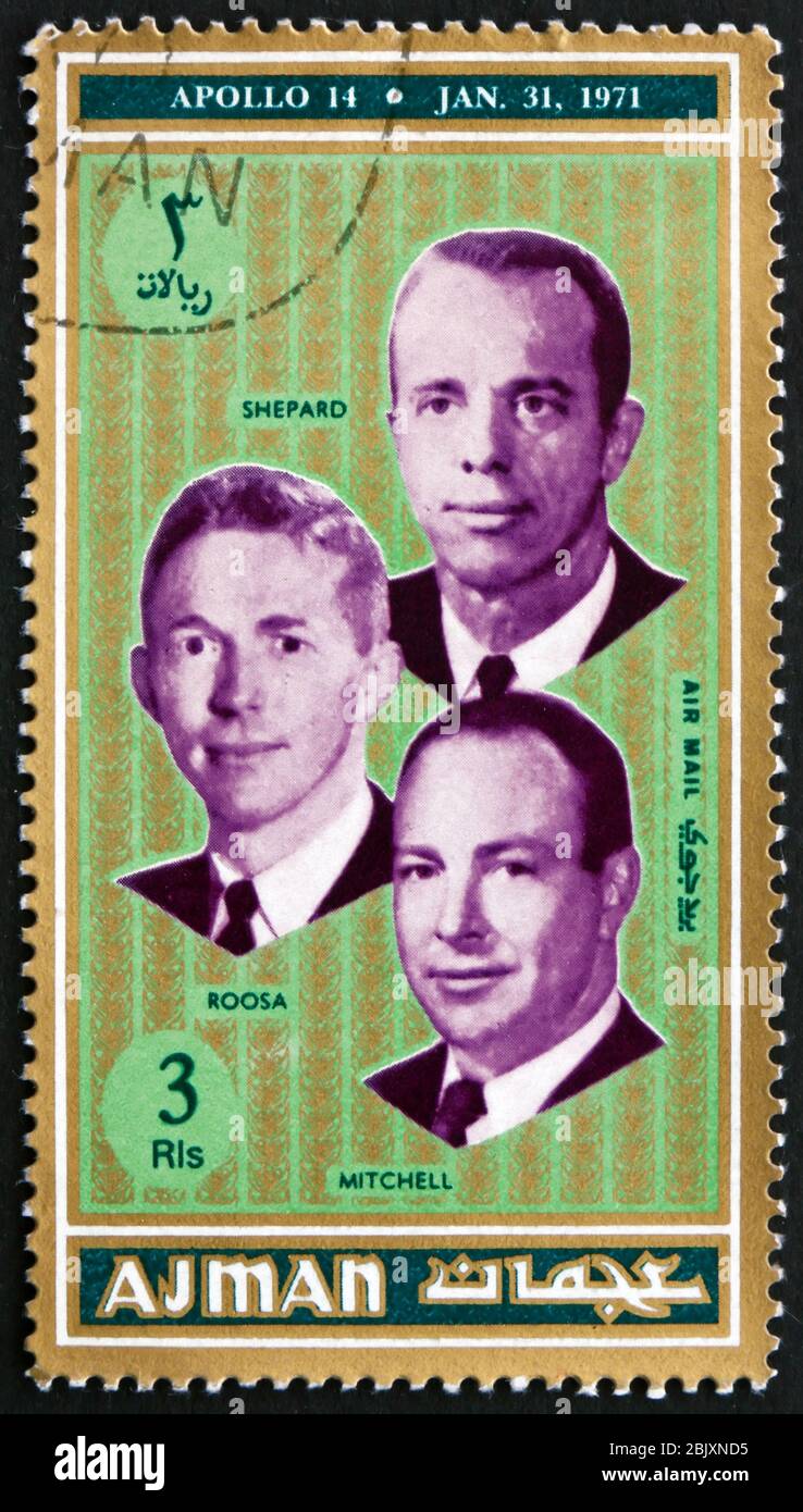 AJMAN - CIRCA 1971: a stamp printed in Ajman shows Shepard, Roosa and Mitchel, Astronauts ...