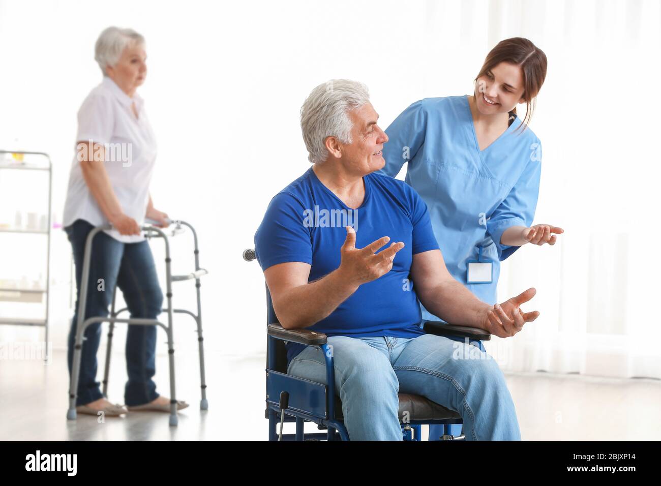 Looking after disabled people at home hi-res stock photography and ...