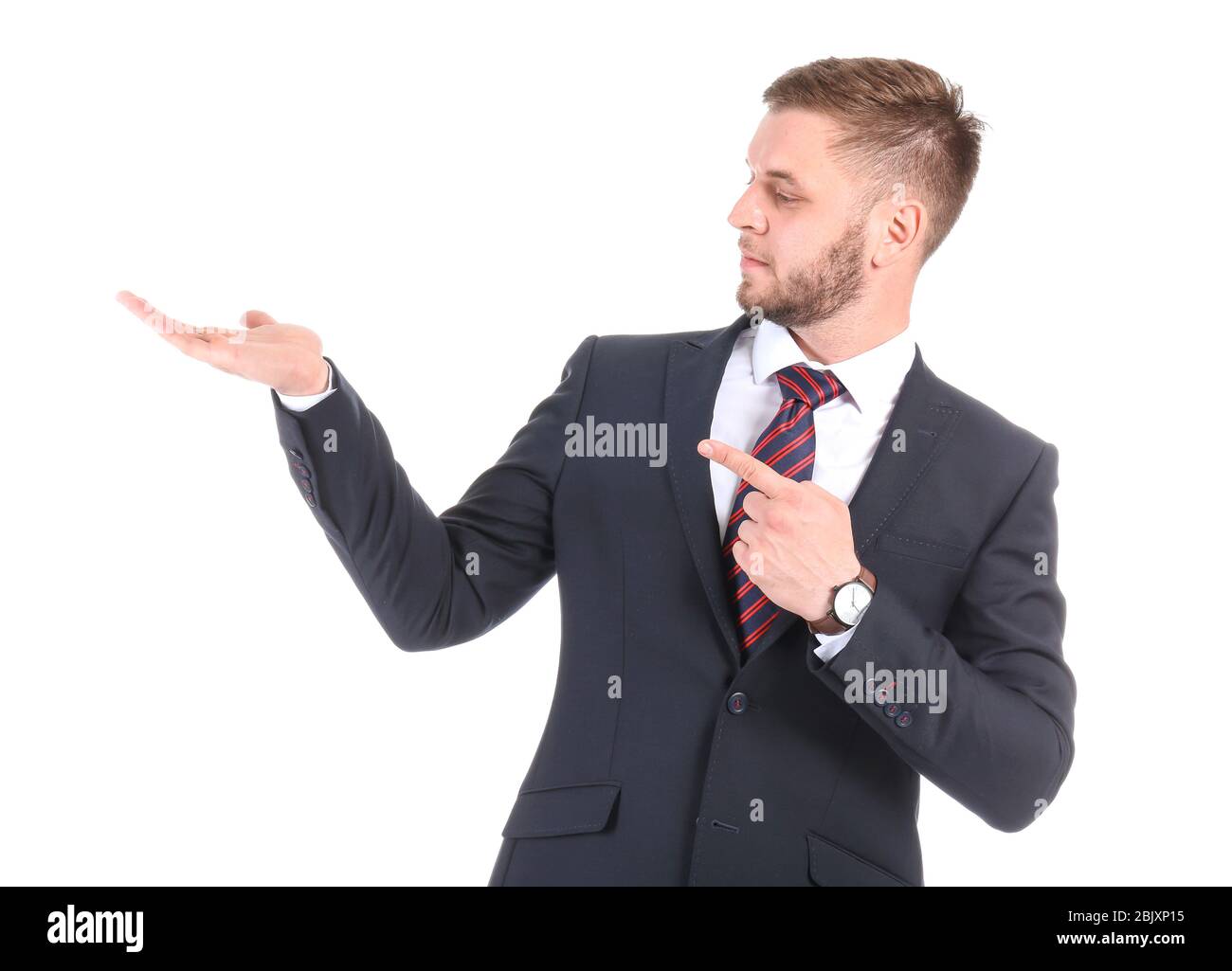 Handsome businessman holding something on white background Stock Photo ...