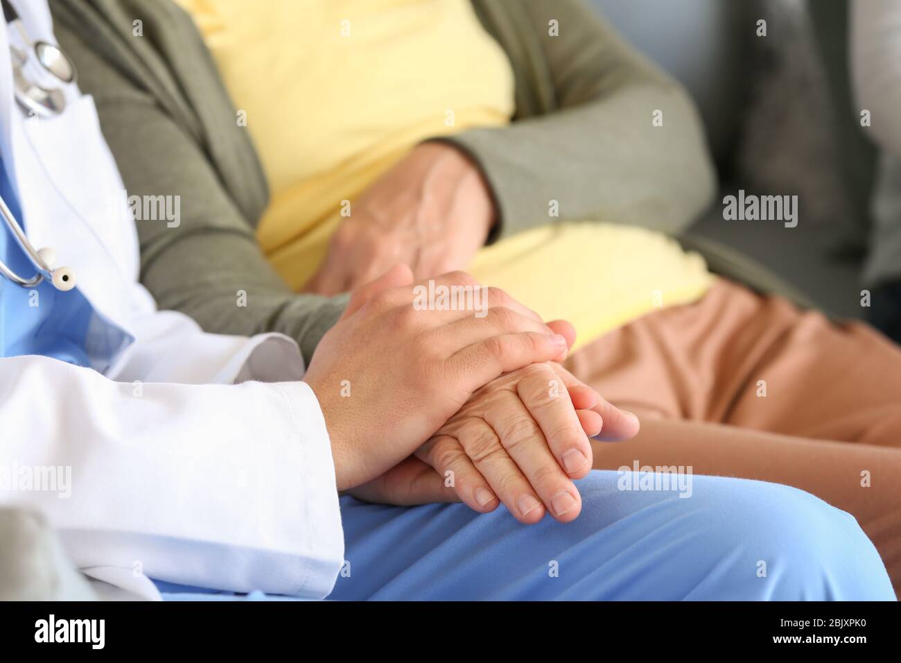 Young man looking after elderly hi-res stock photography and images - Alamy