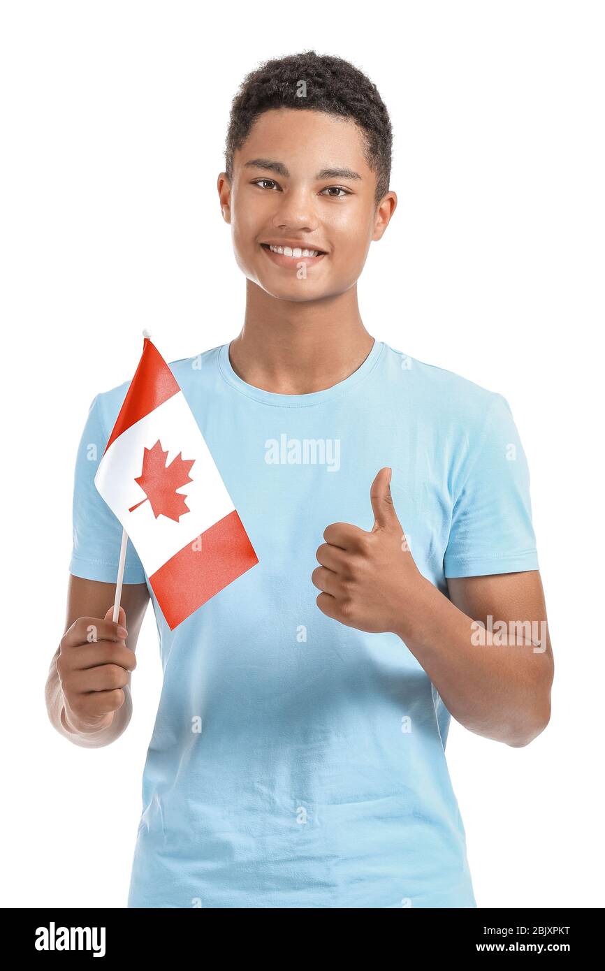 African-American teenage boy with Canadian flag on white background ...