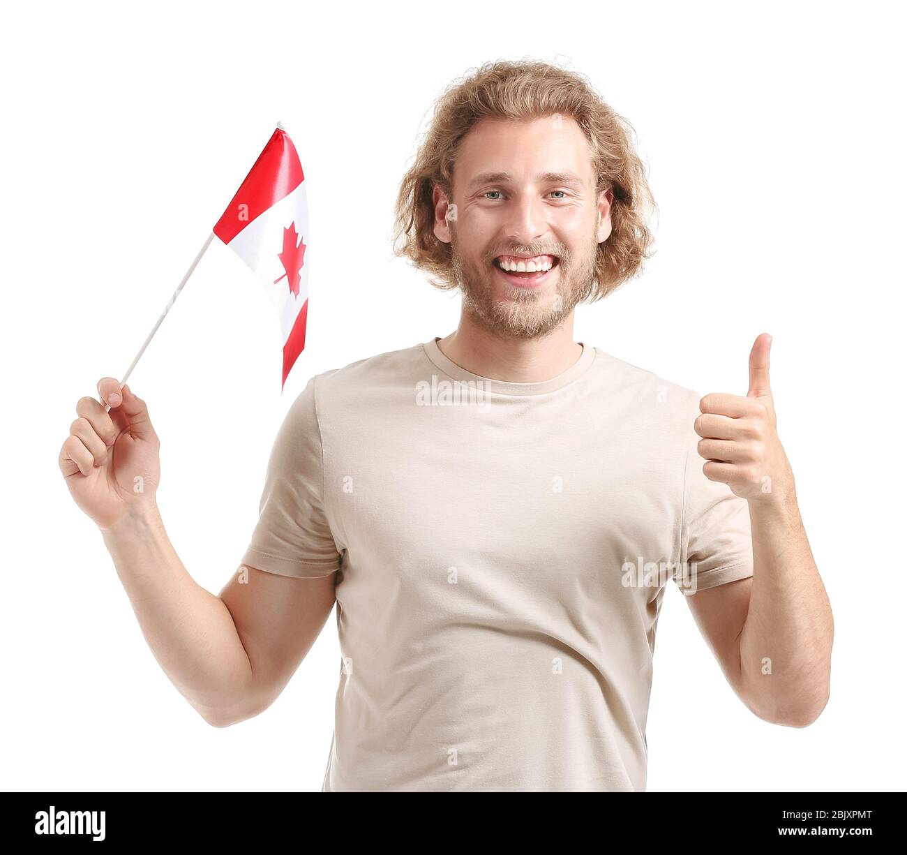 Young man with Canadian flag on white background Stock Photo - Alamy