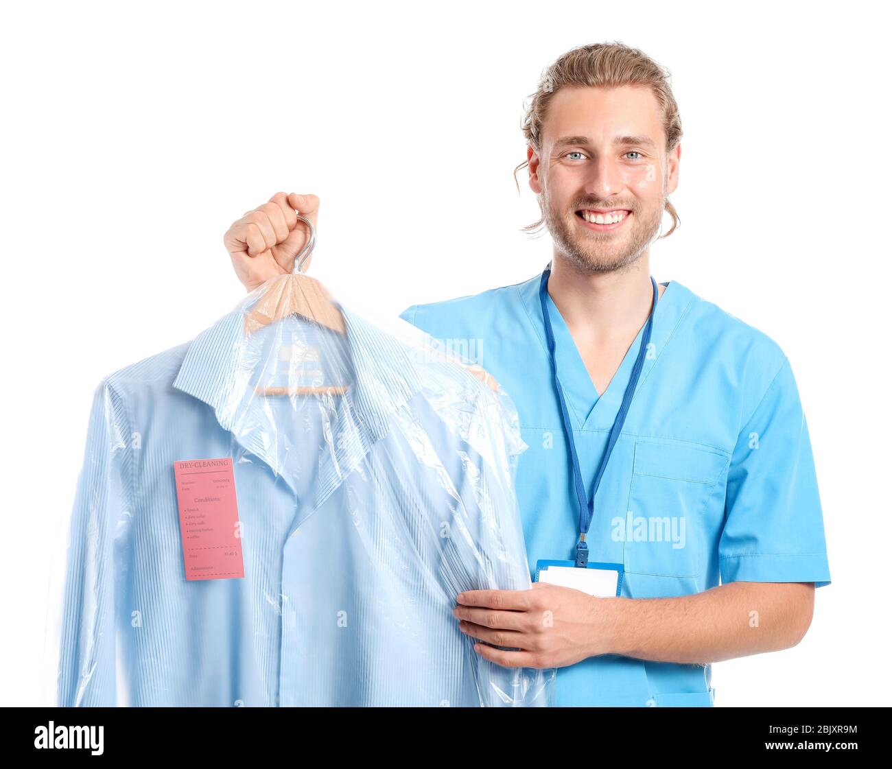 Male worker of modern dry-cleaner's on white background Stock Photo - Alamy