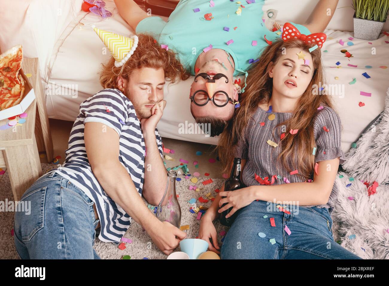Young people sleeping after party at home Stock Photo - Alamy