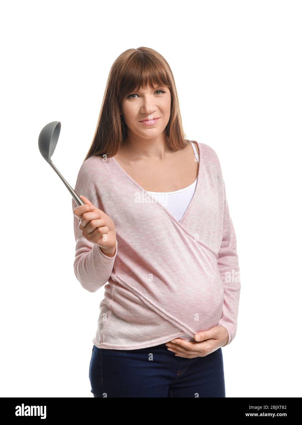 Beautiful pregnant woman with ladle on white background Stock Photo - Alamy