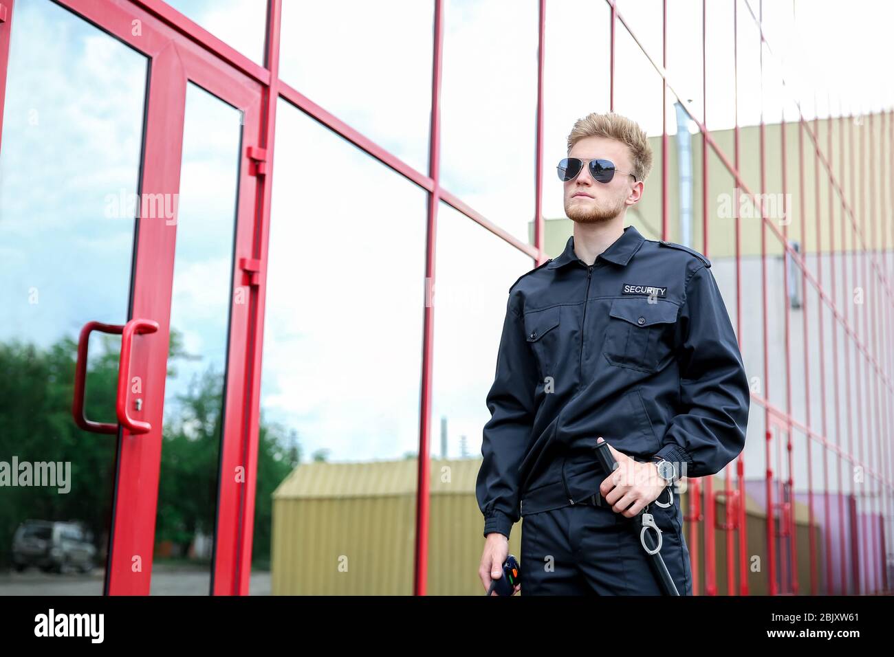 Handsome male security guard outdoors Stock Photo - Alamy