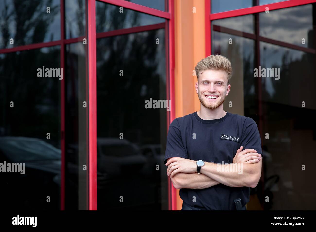 Handsome male security guard outdoors Stock Photo - Alamy