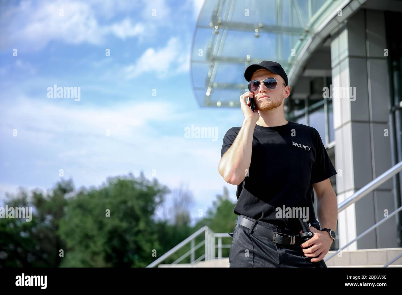 Security guard talking hi-res stock photography and images - Alamy