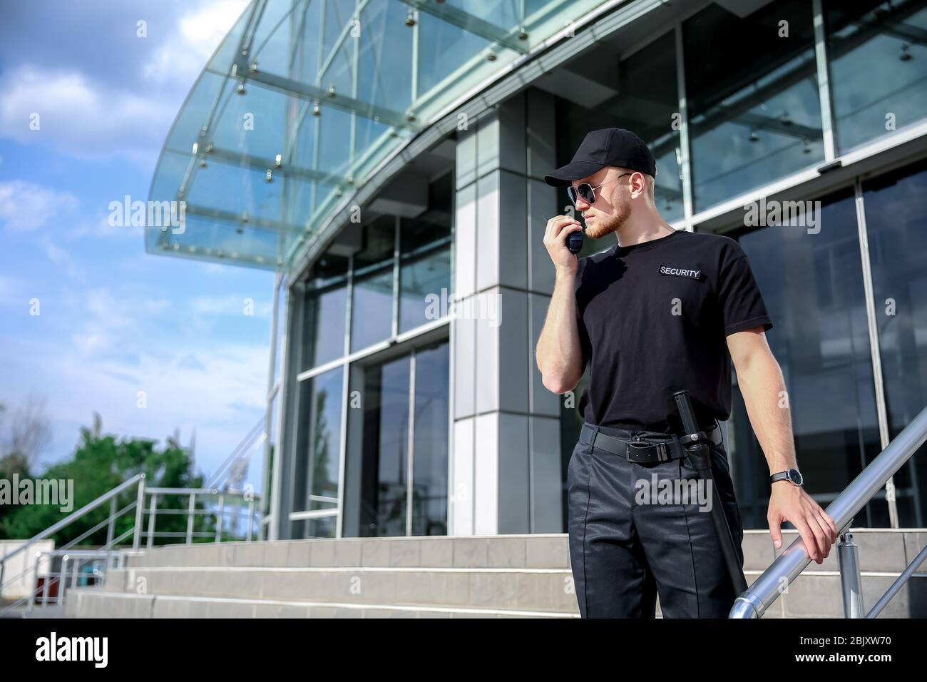 Handsome male security guard outdoors Stock Photo - Alamy