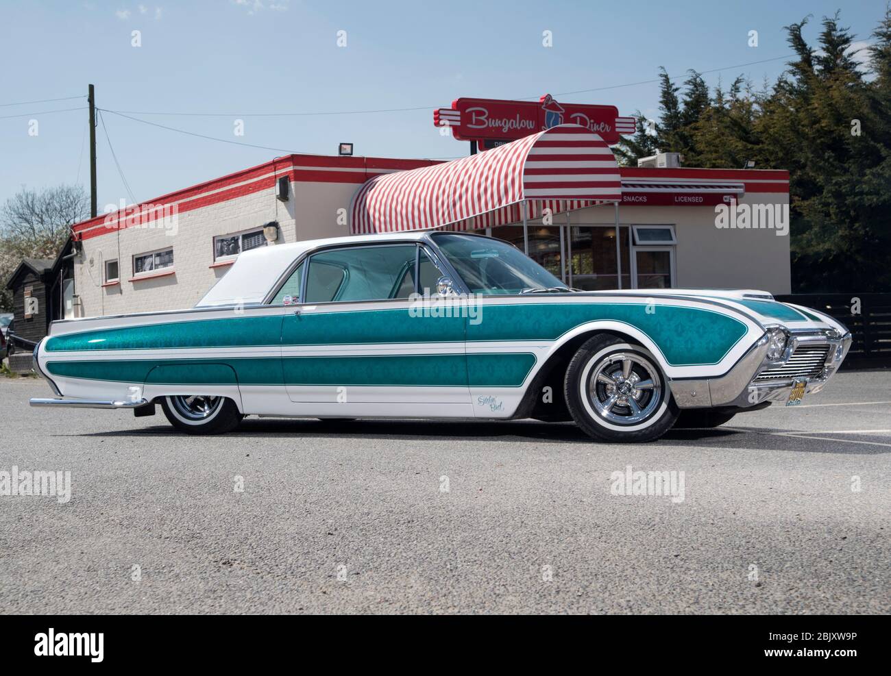 Ford Thunderbird low rider with LA Gang style girl Stock Photo - Alamy