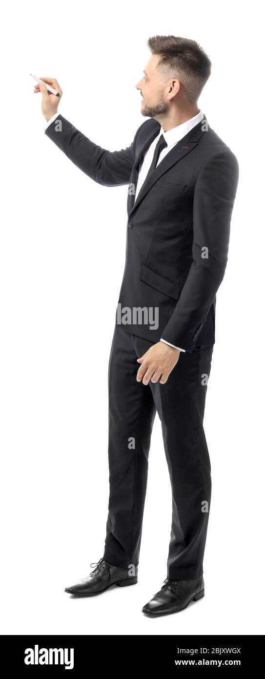 Handsome male teacher writing something against white background Stock ...