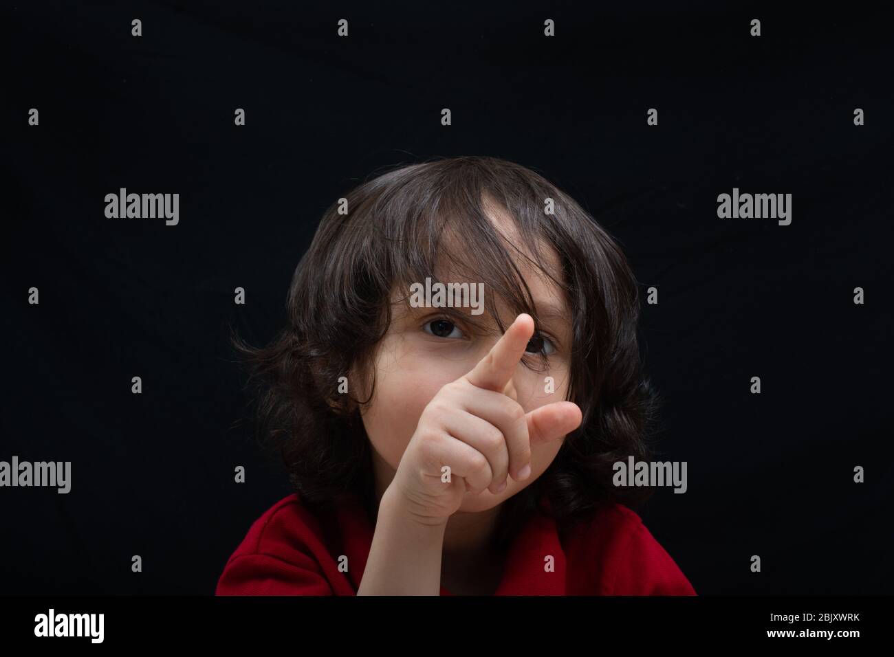 Happy smiling kid boy pointing finger Stock Photo - Alamy