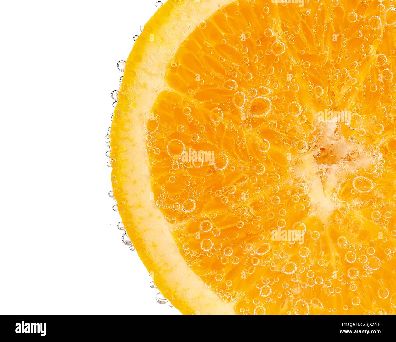 Ripe orange slice in water against white background, closeup Stock ...