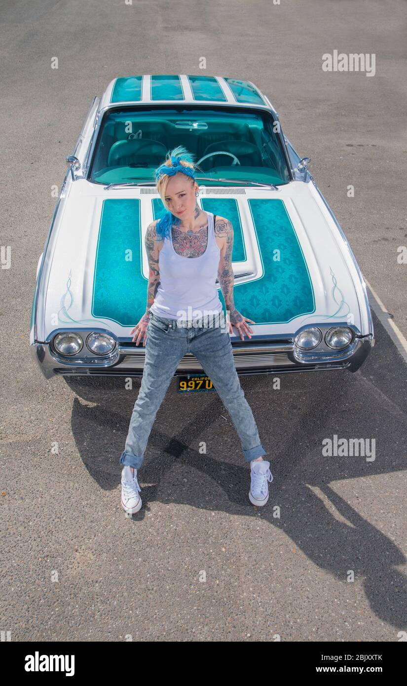 Ford Thunderbird low rider with LA Gang style girl Stock Photo - Alamy