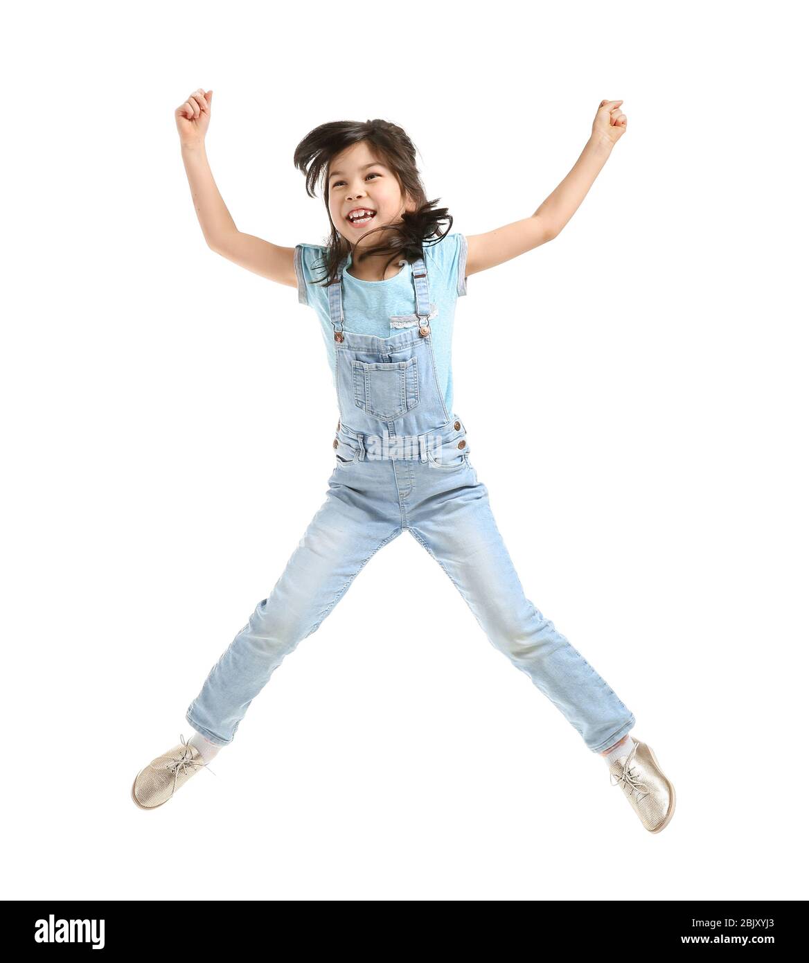 Portrait of jumping little girl on white background Stock Photo - Alamy
