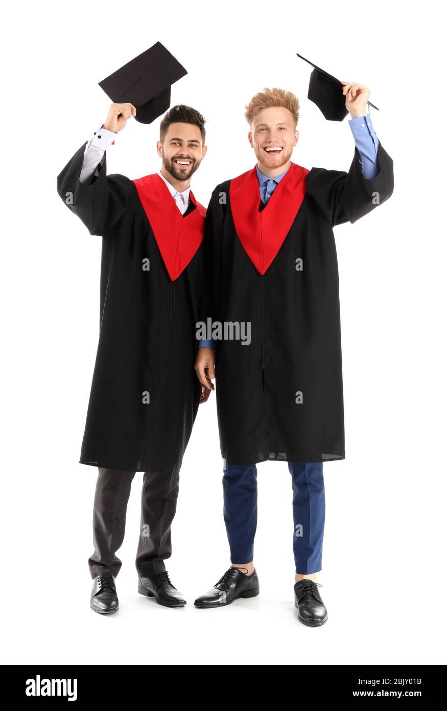 Young students in bachelor robes on white background Stock Photo - Alamy