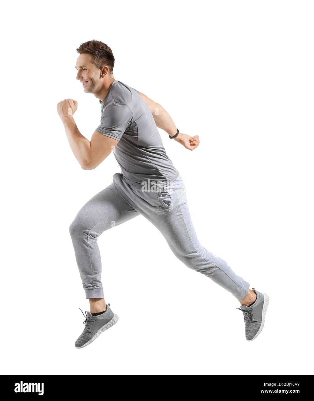 Running young man on white background Stock Photo - Alamy