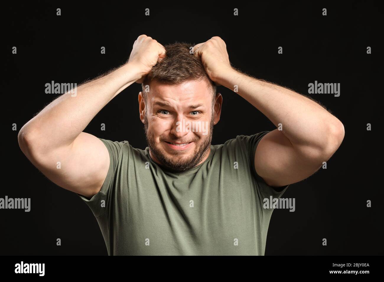 Man having panic attack on dark background Stock Photo - Alamy