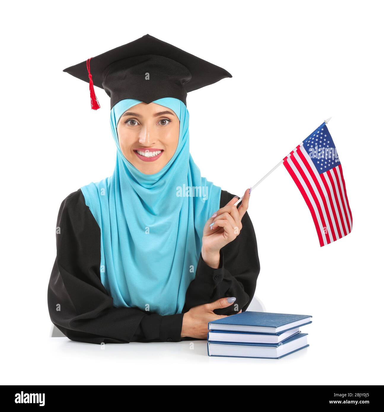 Muslim female graduate with USA flag on white background Stock Photo ...