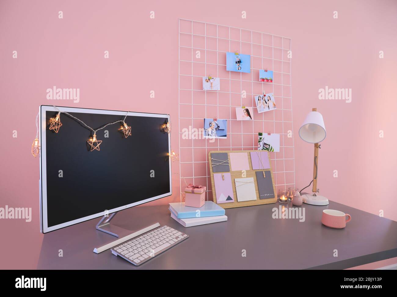 Workplace with mood board and computer in modern room Stock Photo - Alamy