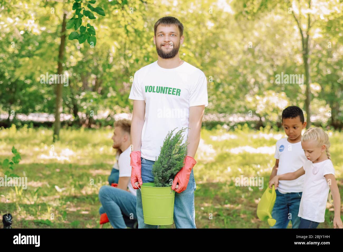 Child volunteer tree hi-res stock photography and images - Alamy