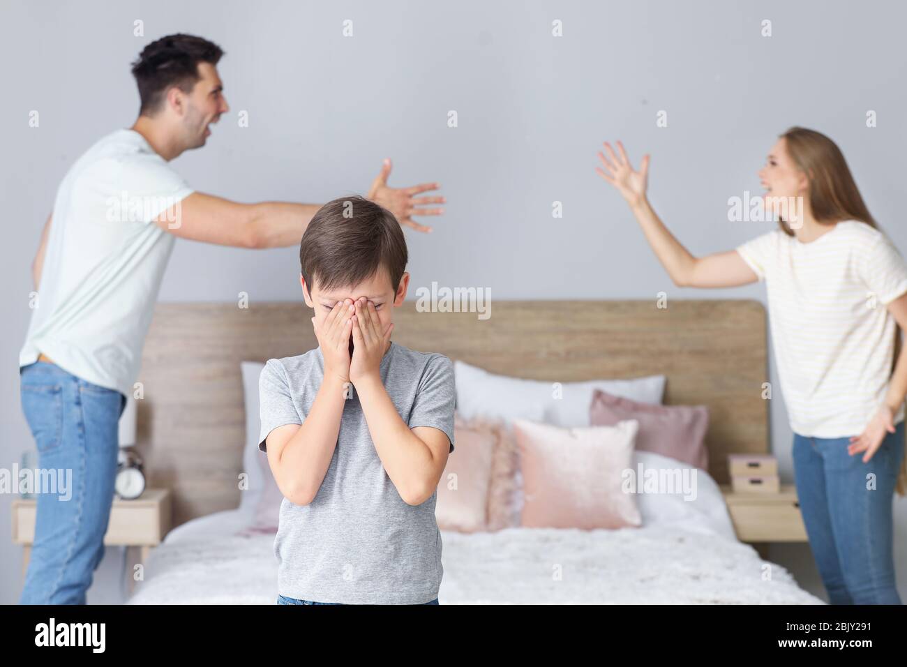 Sad little boy and his quarreling parents at home Stock Photo - Alamy