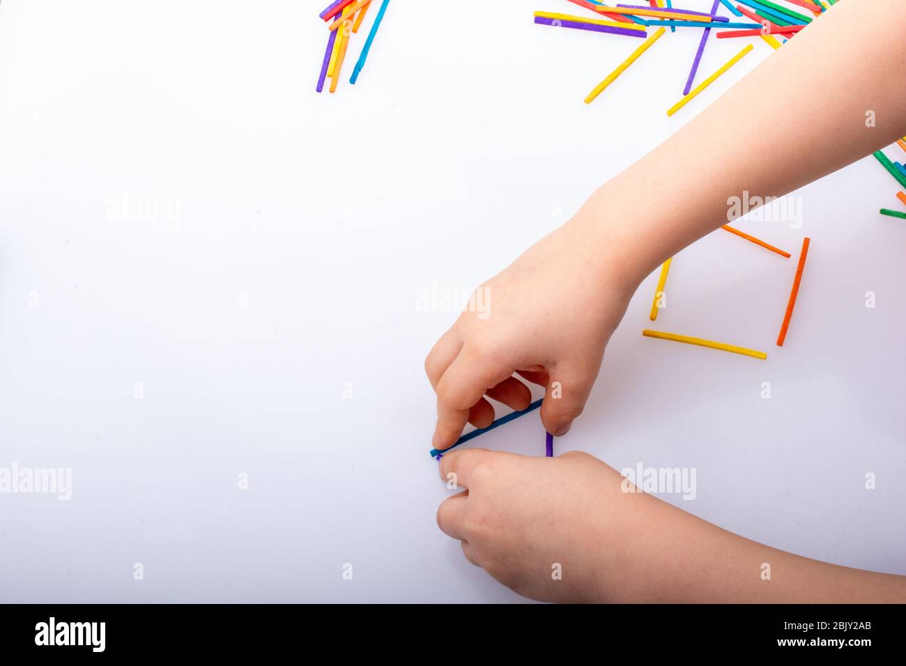 Kid making triangle shape as creative concept Stock Photo - Alamy