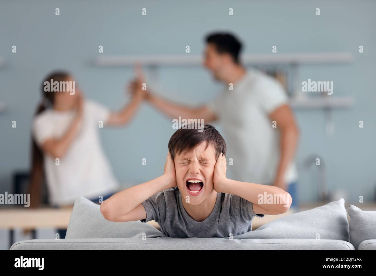Stressed little boy and his quarreling parents at home Stock Photo - Alamy
