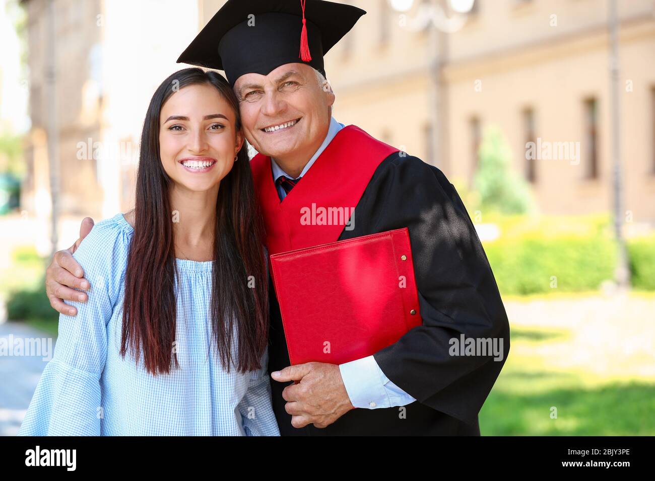 Daughter with father on his graduation day Stock Photo - Alamy