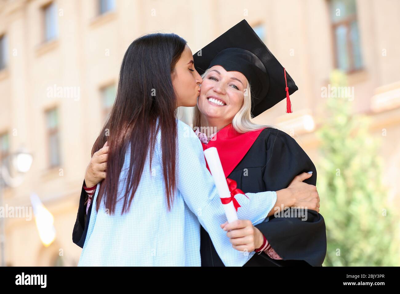 Daughter with mother on her graduation day Stock Photo - Alamy