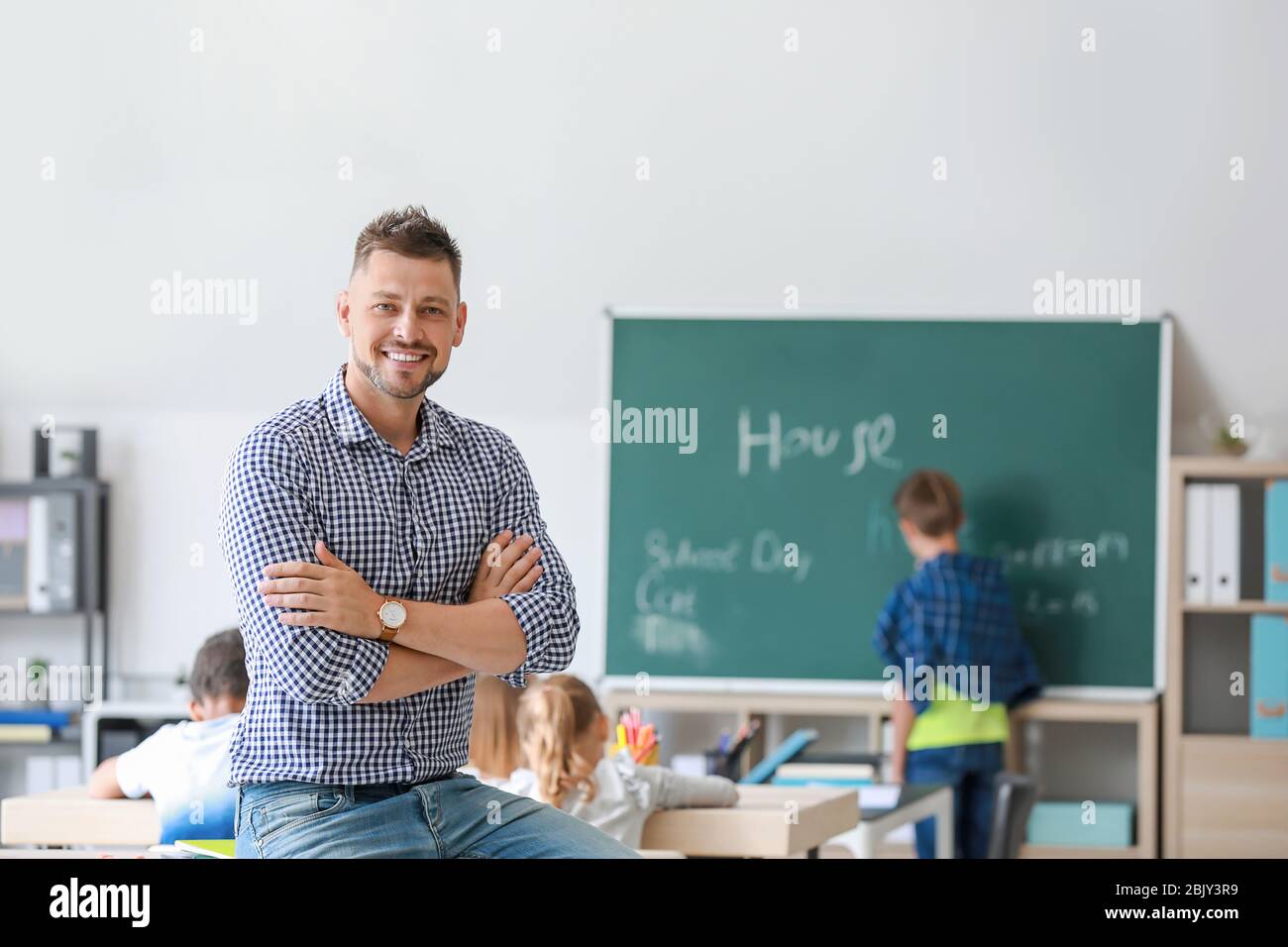 Male teacher primary hi-res stock photography and images - Alamy