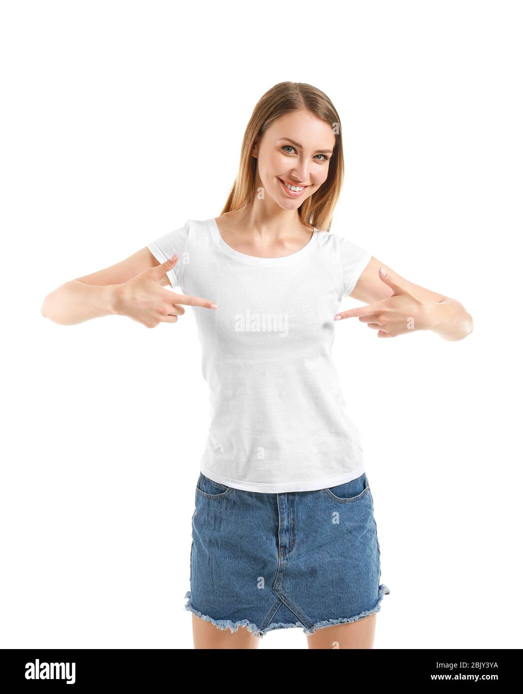 Woman pointing at her t-shirt against white background Stock Photo - Alamy