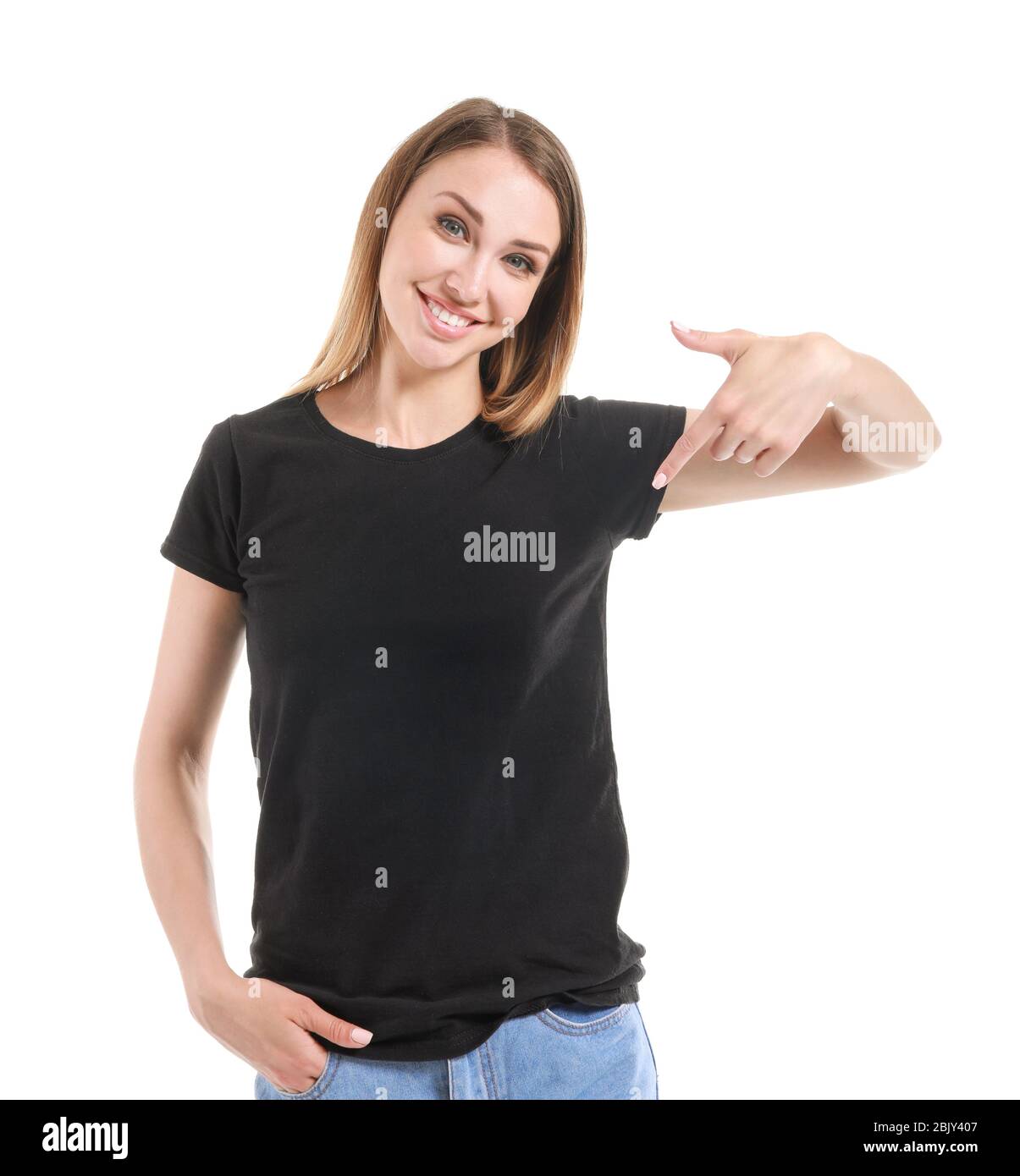 Woman pointing at her t-shirt against white background Stock Photo - Alamy