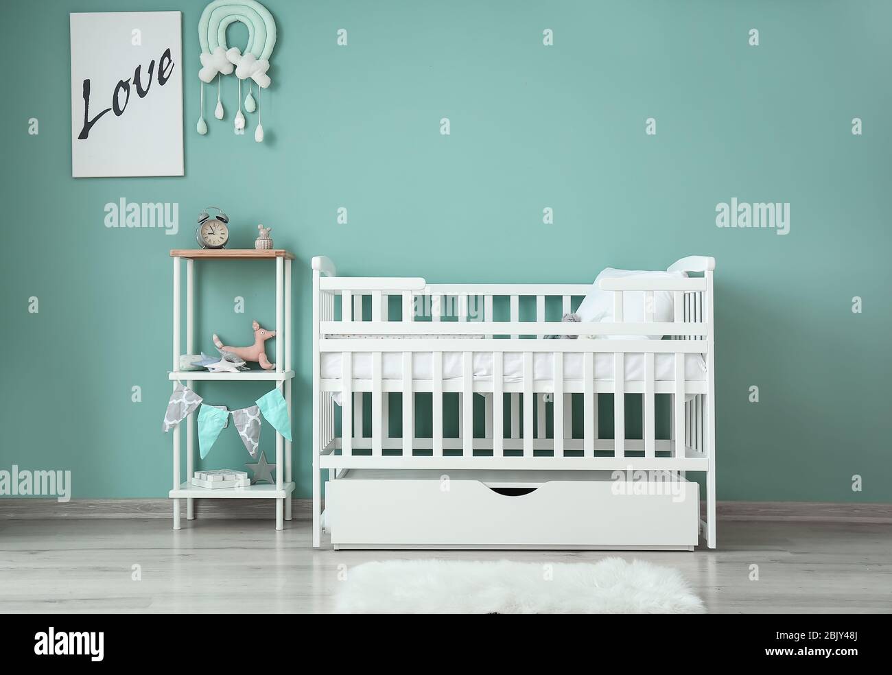 Interior of modern baby room with crib Stock Photo - Alamy