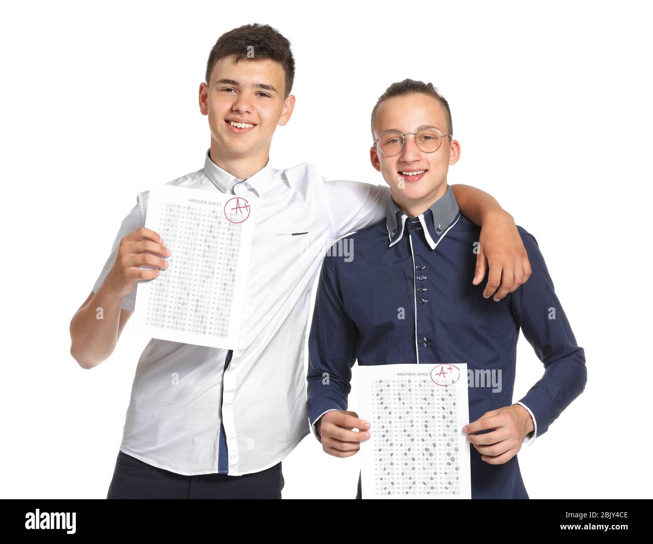 Happy boys with results of school test on white background Stock Photo ...