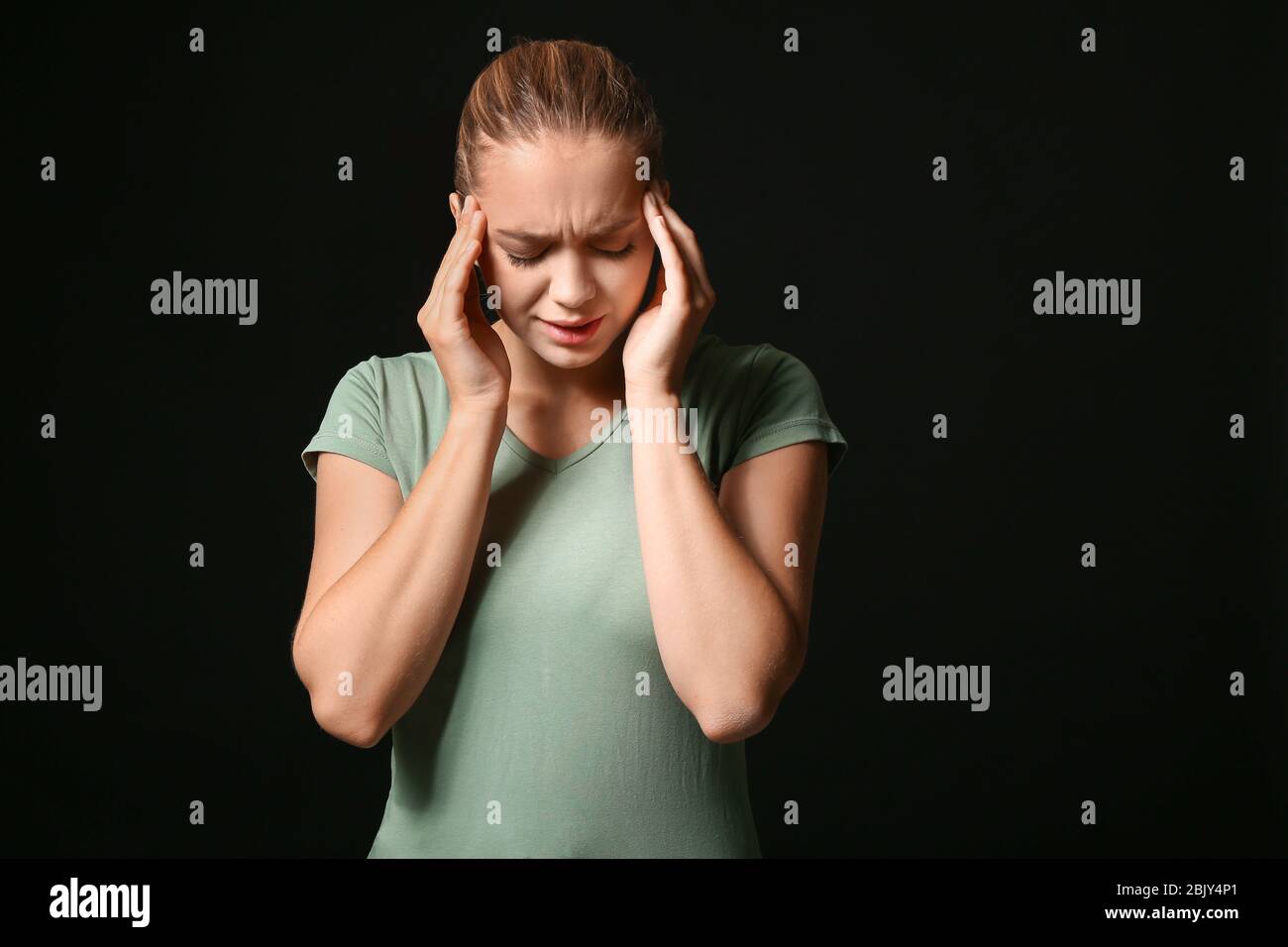 Woman having panic attack on dark background Stock Photo - Alamy
