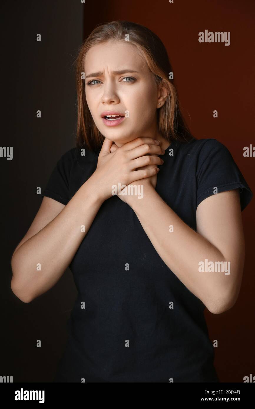 Woman having panic attack on dark background Stock Photo - Alamy