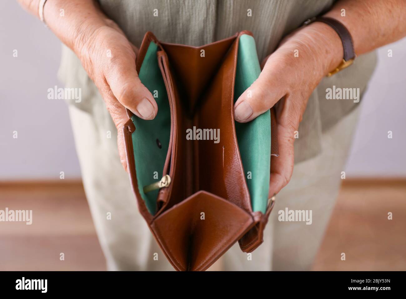 Elderly woman with empty wallet, closeup. Concept of poverty in ...