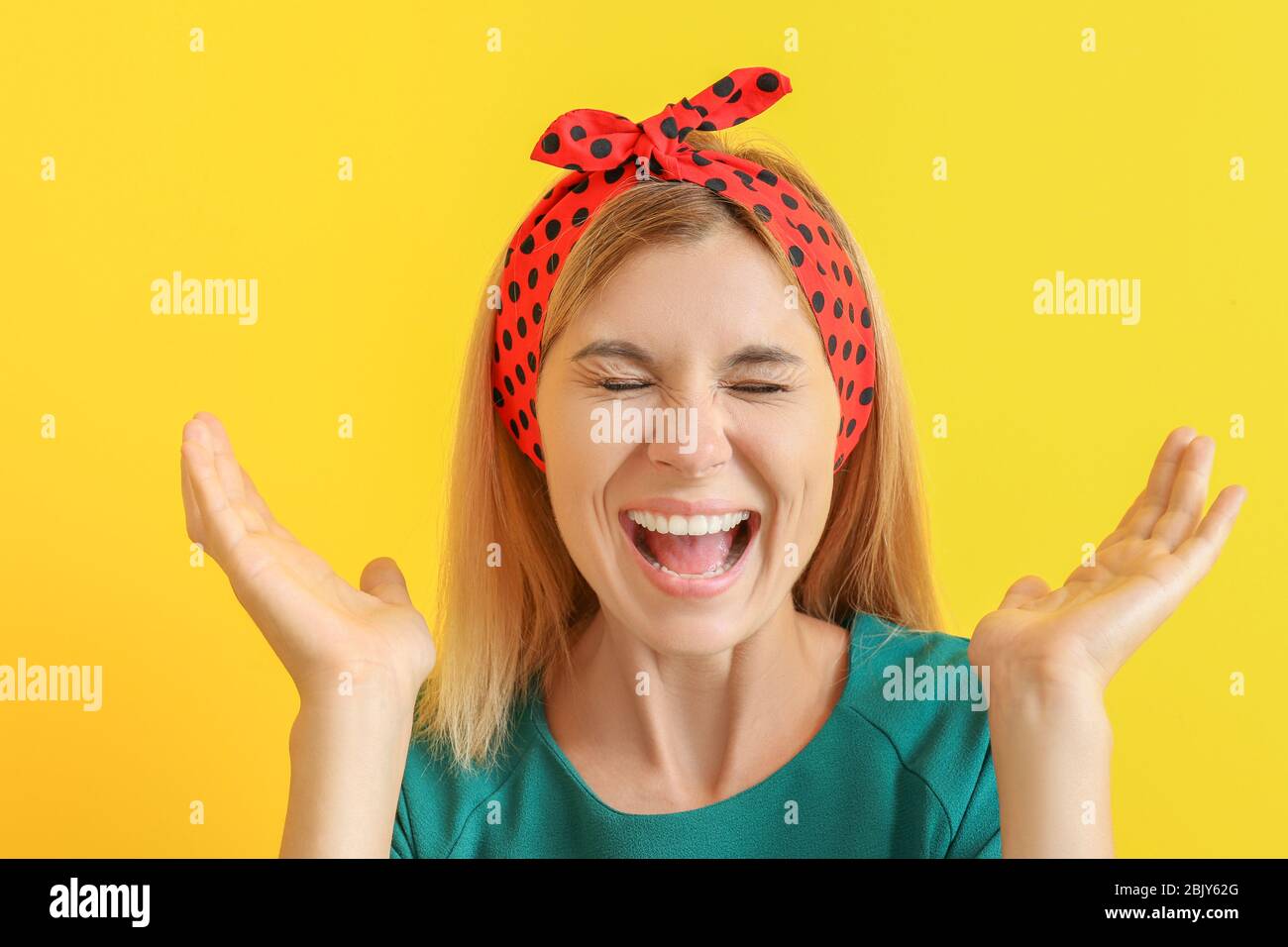 Screaming beautiful woman on color background Stock Photo - Alamy