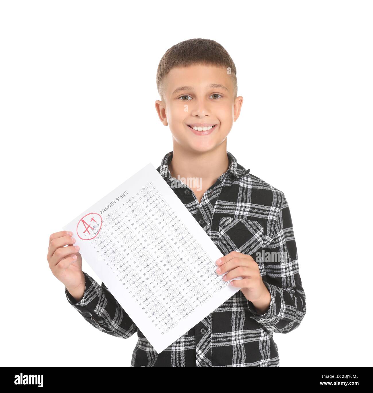 Happy boy with answer sheet for school test on white background Stock ...