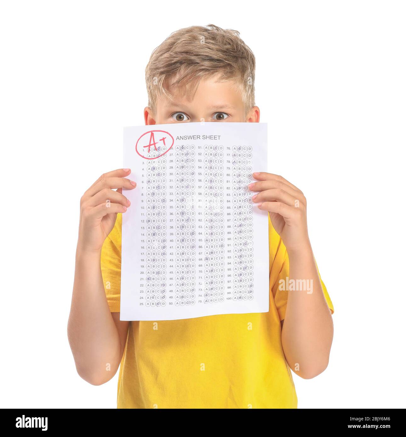 Boy with answer sheet for school test on white background Stock Photo ...