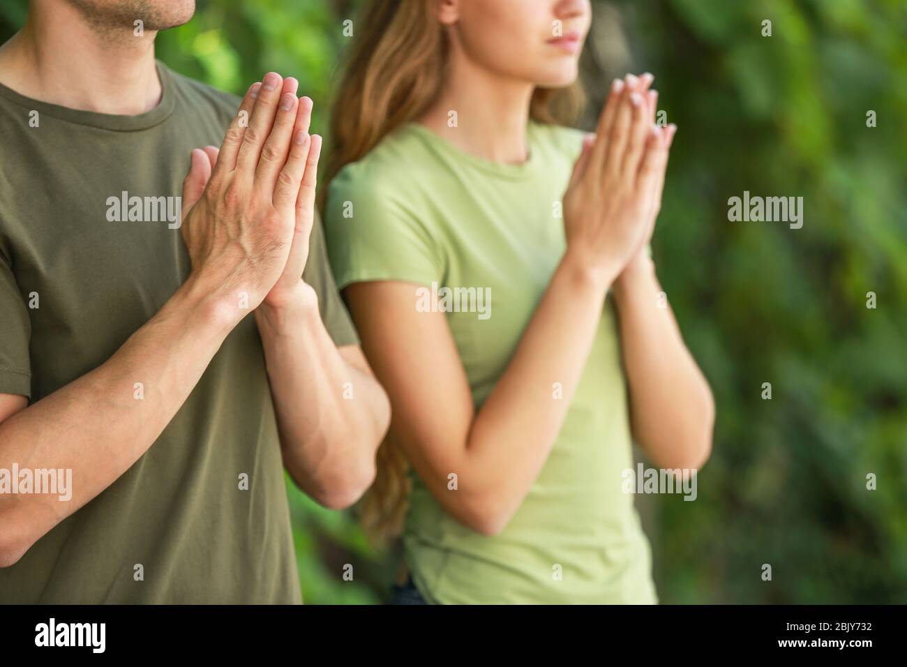 Religious couple praying to God outdoors Stock Photo - Alamy