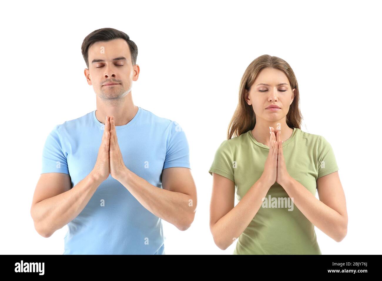Religious couple praying to God on white background Stock Photo - Alamy
