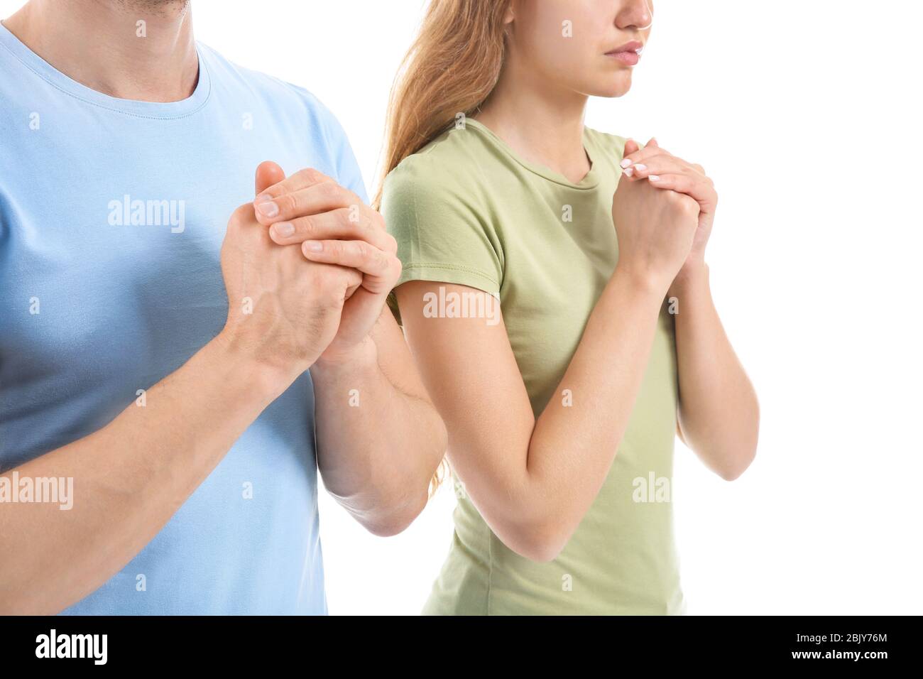 Religious couple praying to God on white background Stock Photo - Alamy