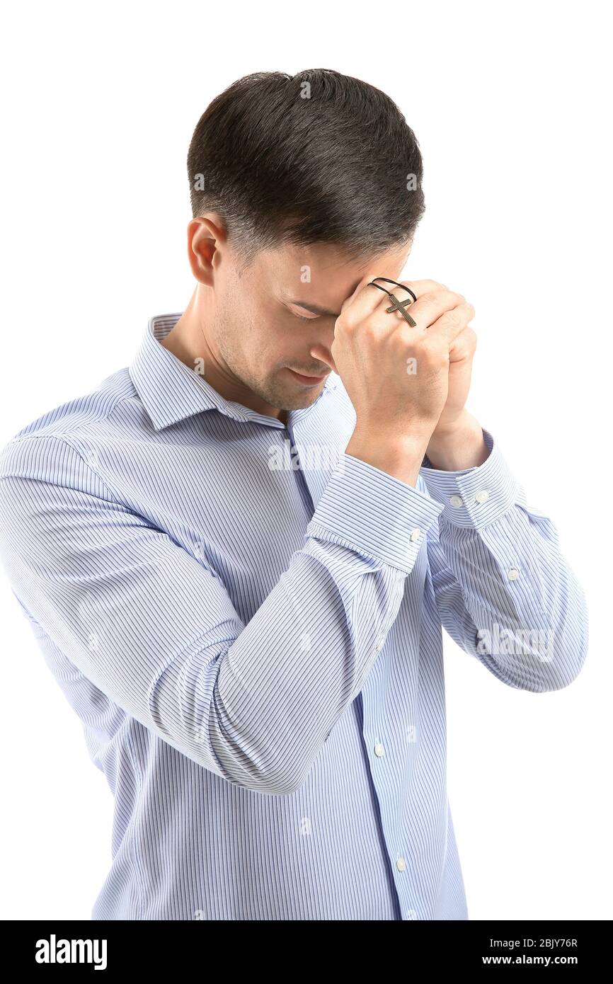 Religious man praying to God on white background Stock Photo - Alamy