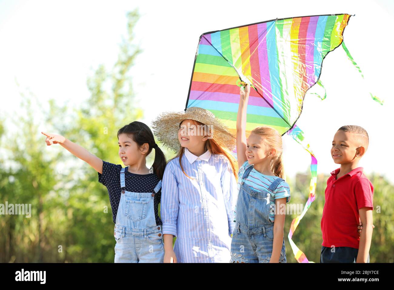 Little children flying kite outdoors Stock Photo - Alamy