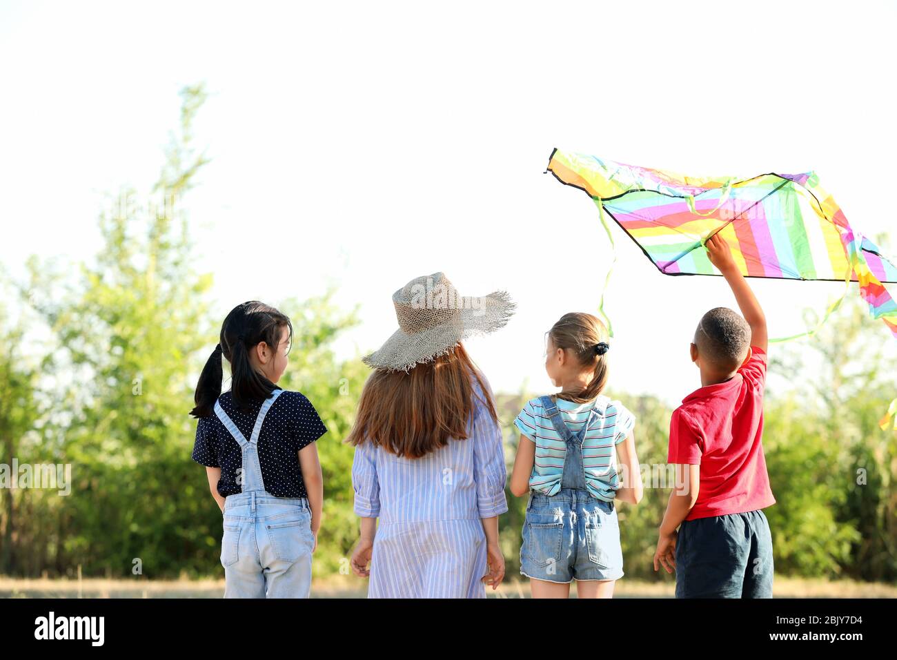 Little children flying kite outdoors Stock Photo - Alamy
