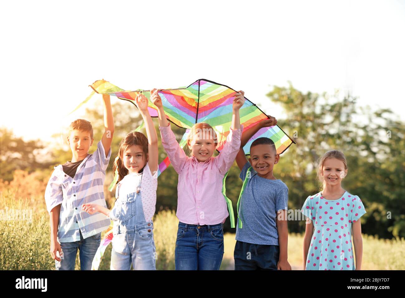 Little children flying kite outdoors Stock Photo - Alamy