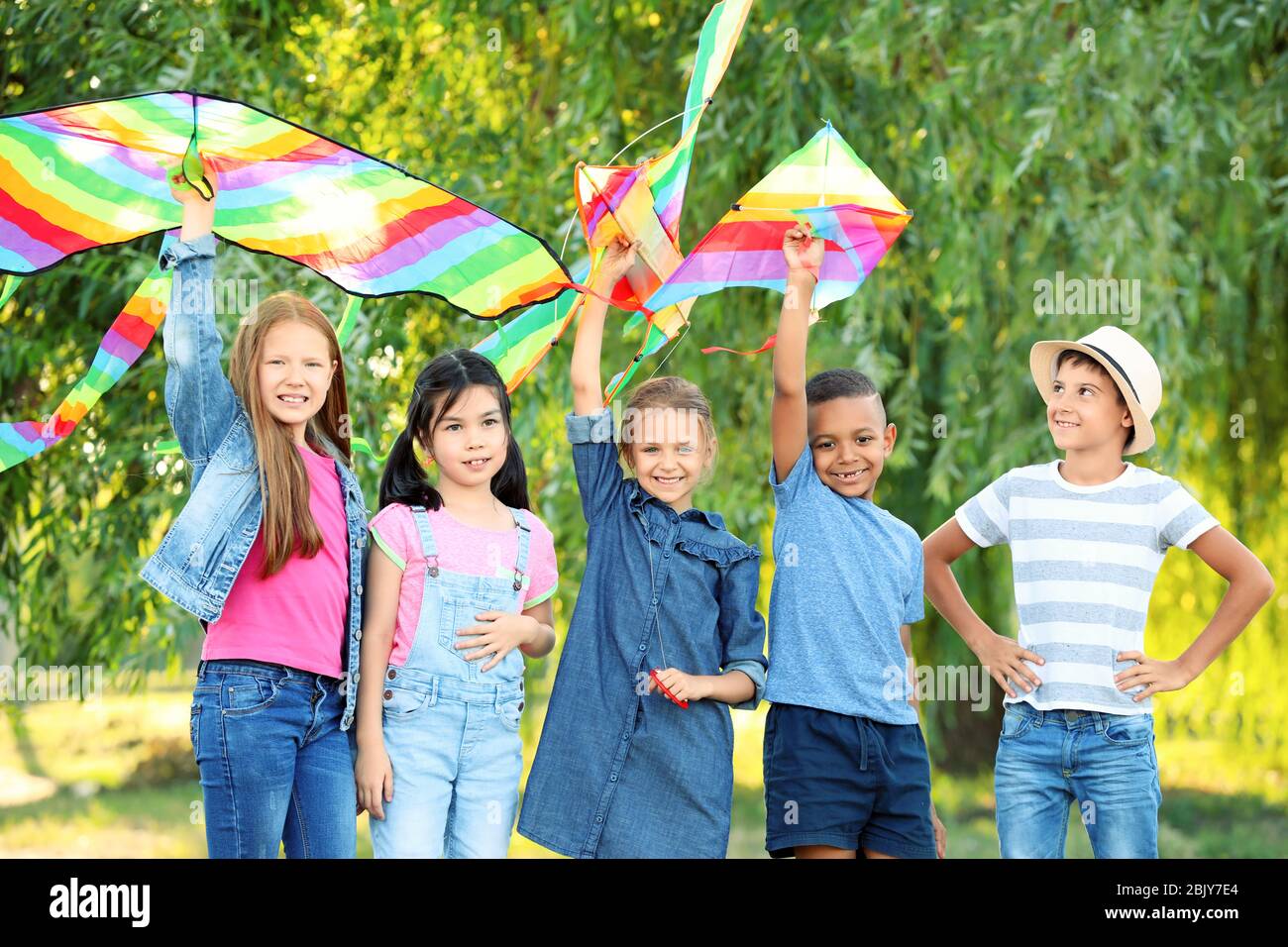 Little children flying kites outdoors Stock Photo - Alamy